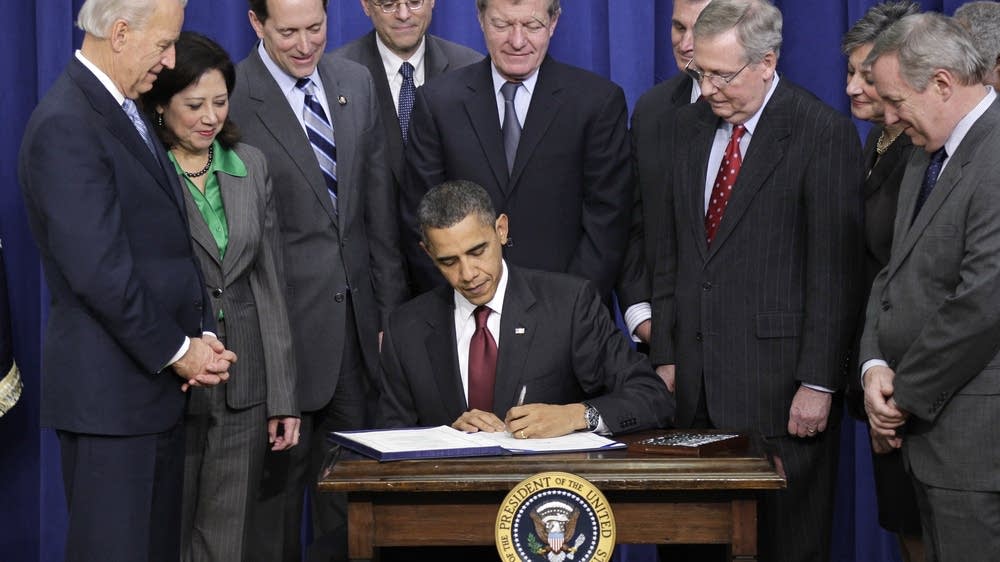 Obama signs massive tax bill, hails deal with GOP | MPR News