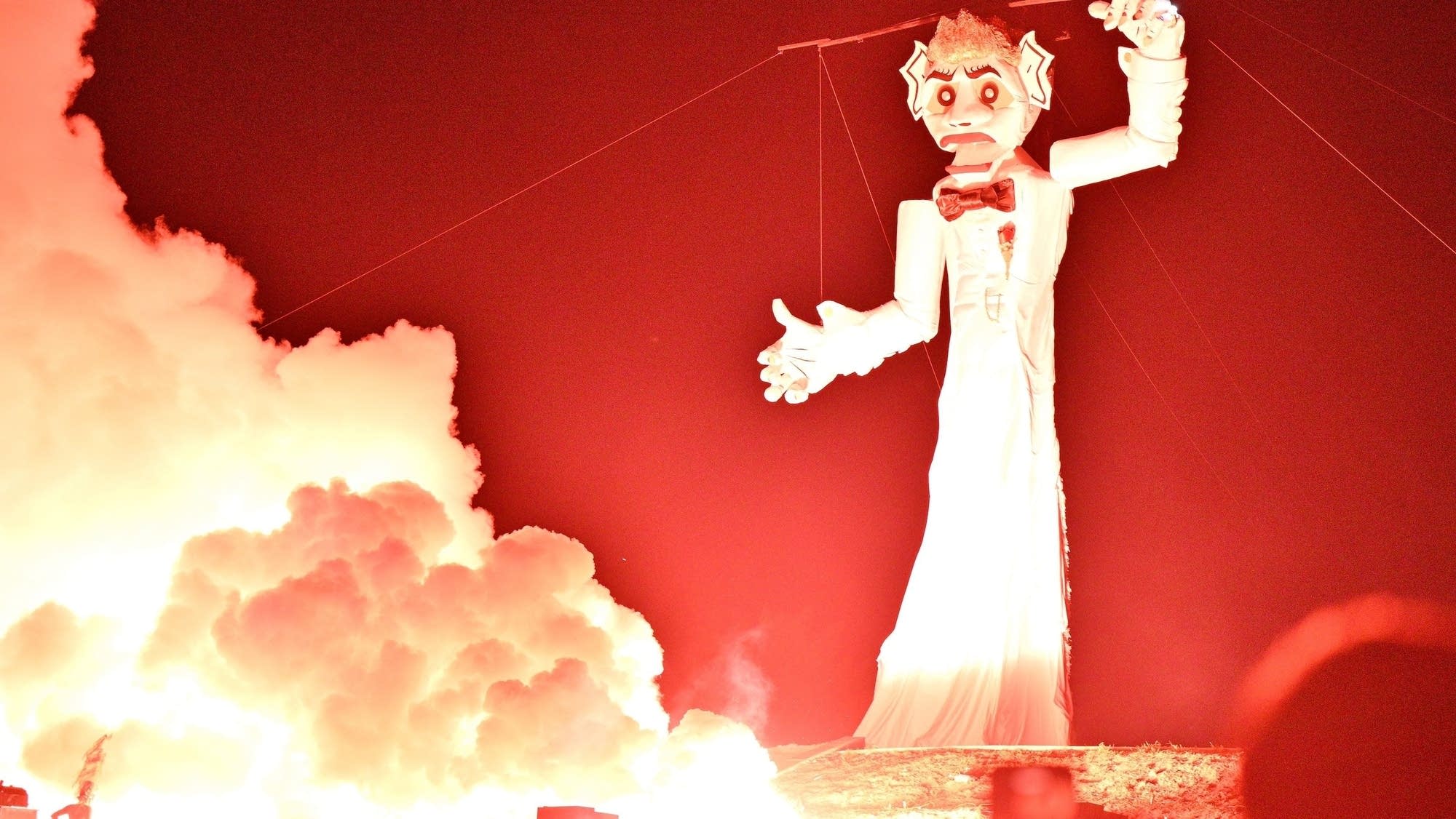 At the Burning of Zozobra, money stress goes up in flames