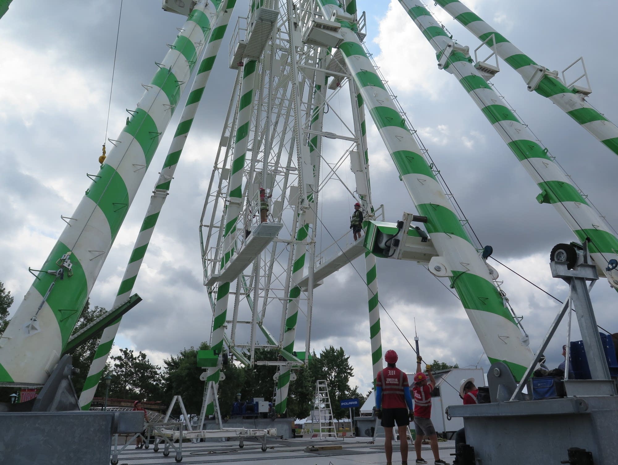 Reinventing the wheel: As State Fair nears, giant ride rises again ...