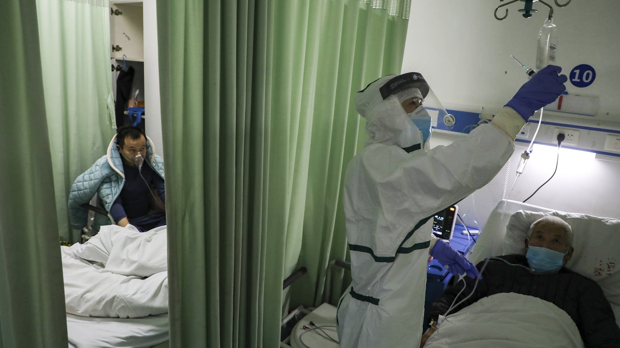 China's virus death toll surpasses SARS, but number of new cases falls ...