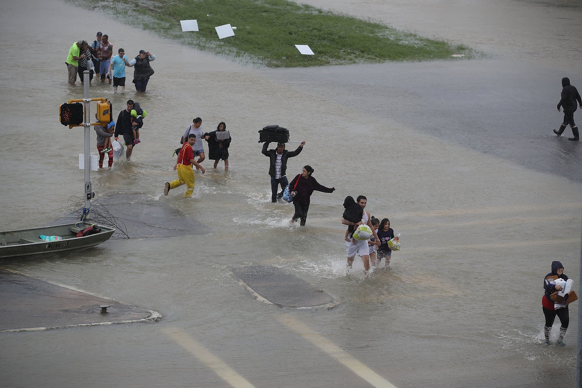 Photos: People (and pets) continue to evacuate from flood waters | MPR News