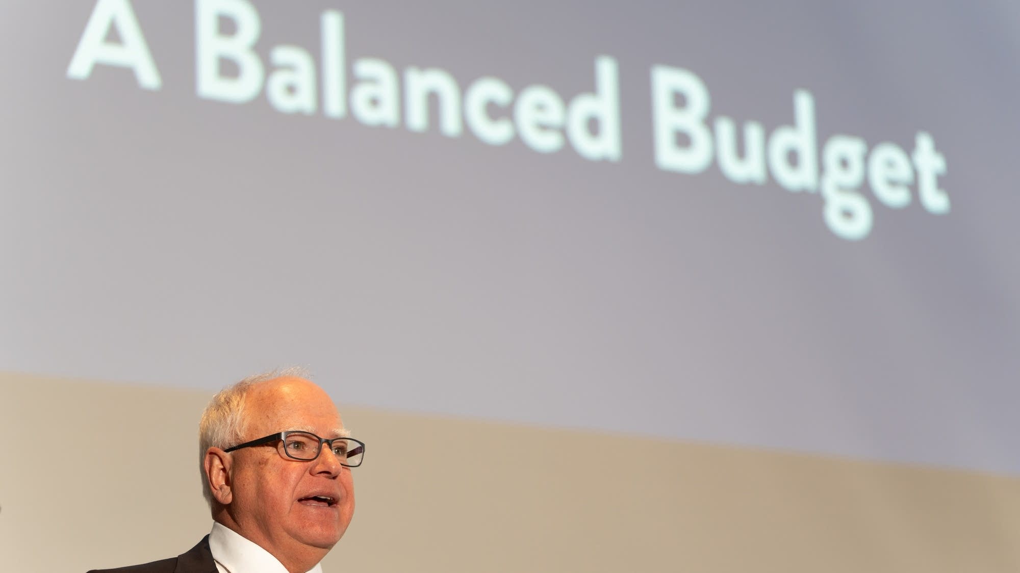 Walz unveils slimmer Minnesota budget, pitches sales tax cut | MPR News