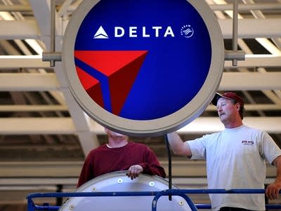 Delta, Northwest can work as single carrier | MPR News