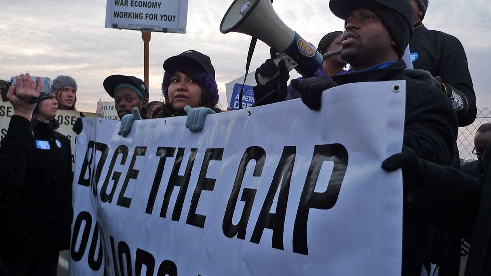 Protesters block Minneapolis bridge; 11 arrested | MPR News