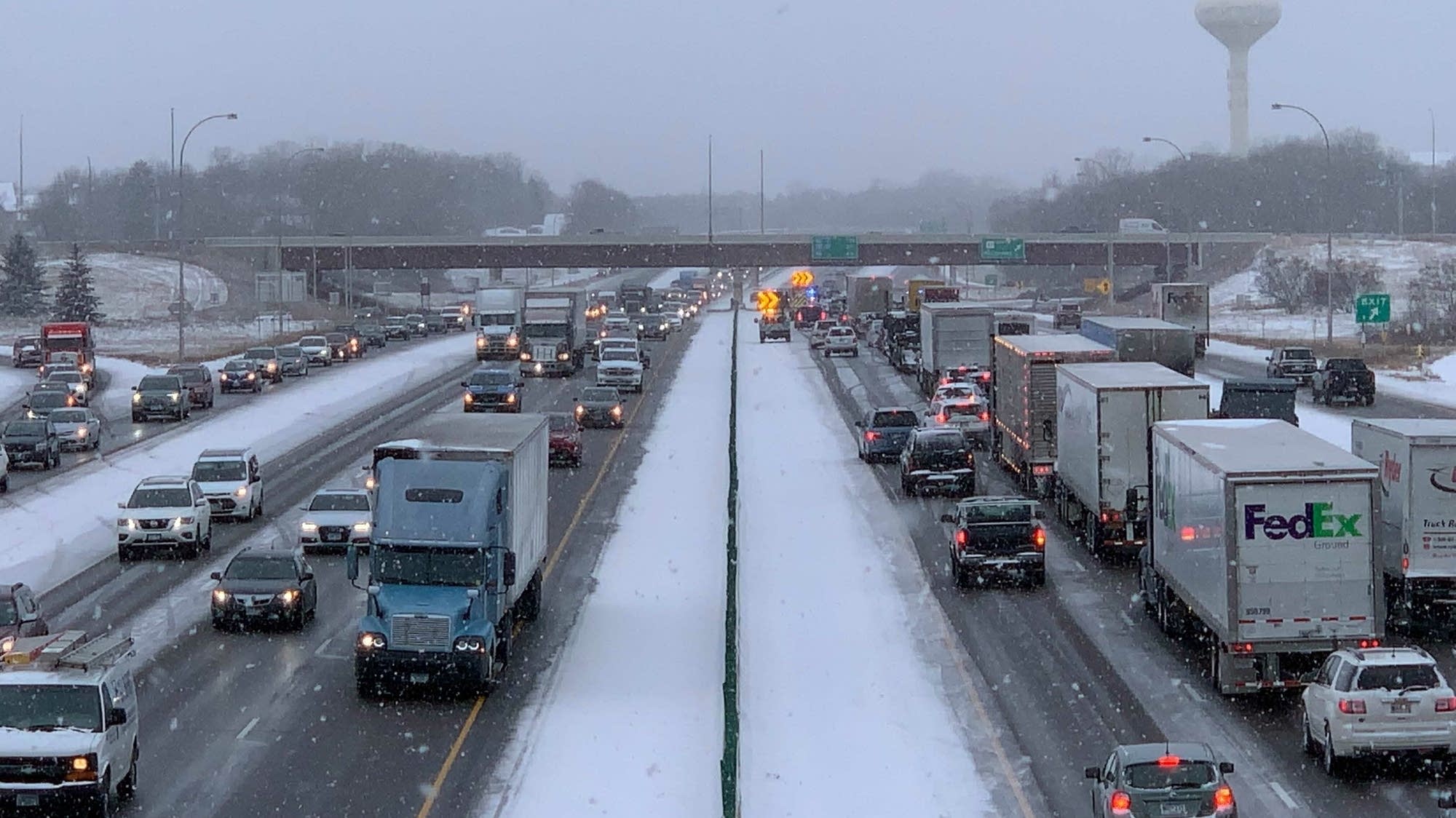 Snow adding up in southern Twin Cities, slick spots on roads | MPR News