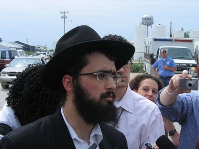 Hundreds rally in Iowa for meatpacking plant workers | MPR News