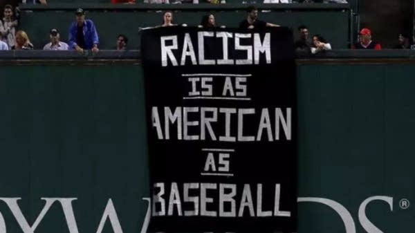 Anti-racism sign unfurled at baseball game | MPR News