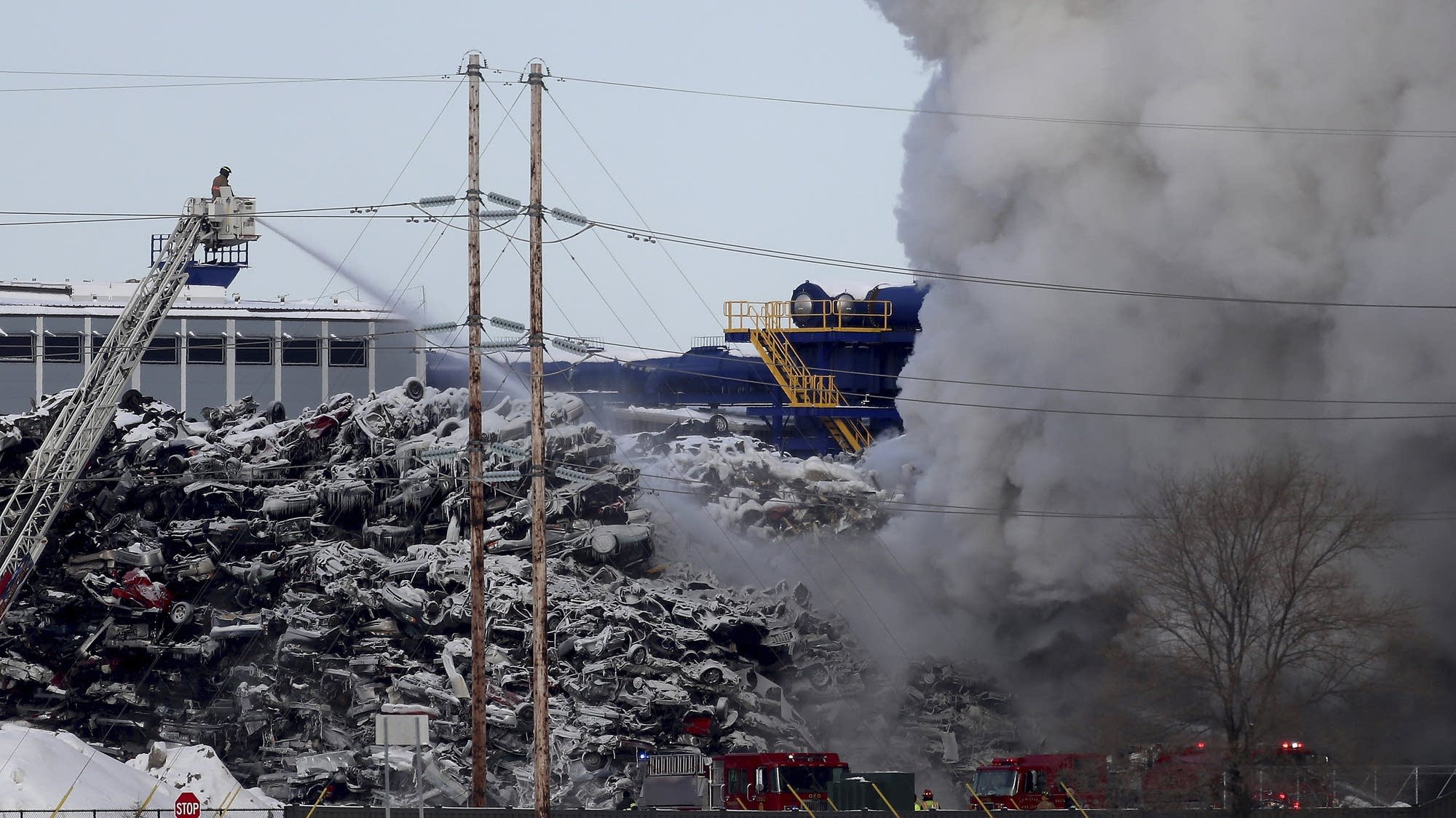 Fire in Becker scrap metal yard continues to send smoke over a wide ...