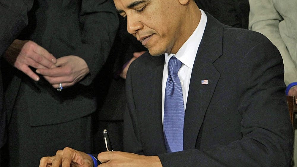 Obama signs historic health care overhaul | MPR News