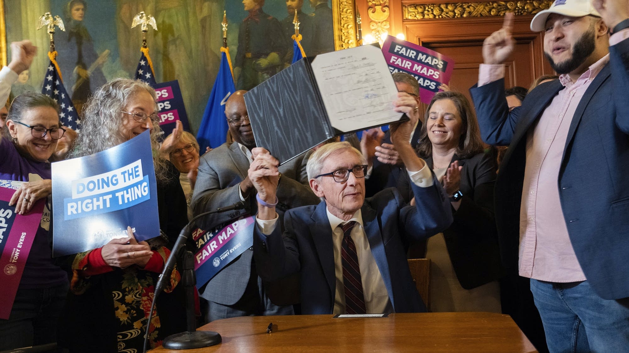Wisconsin’s Democratic governor signs his new legislative maps into law ...