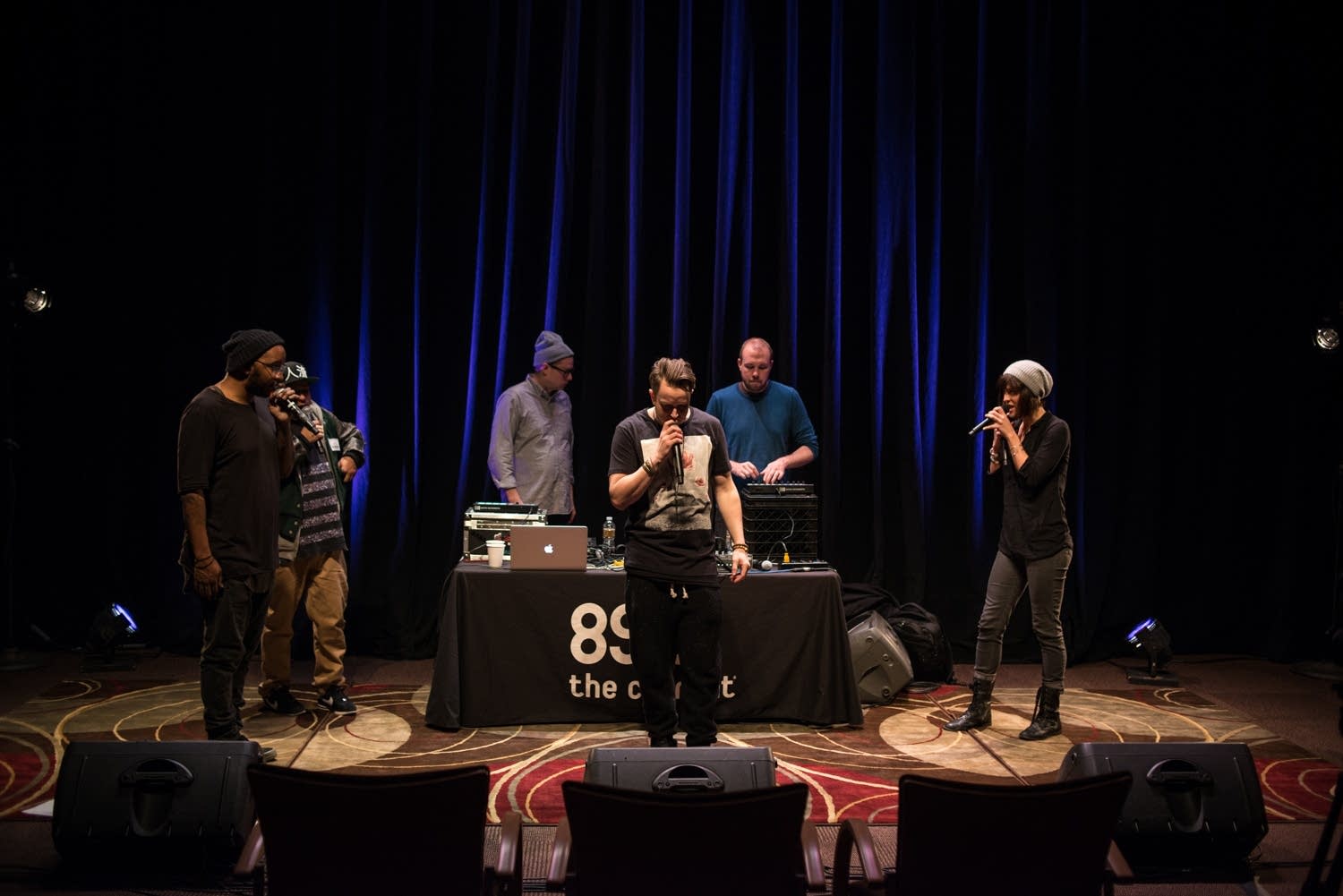 Doomtree perform before a live audience in MPR's Forum