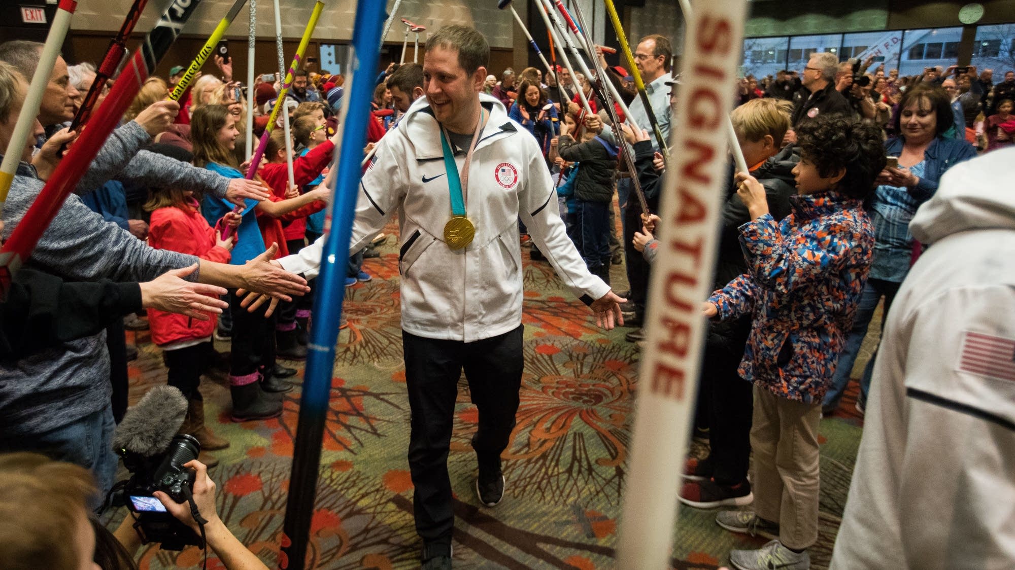 Gold-medal curlers receive hero's welcome in Duluth | MPR News