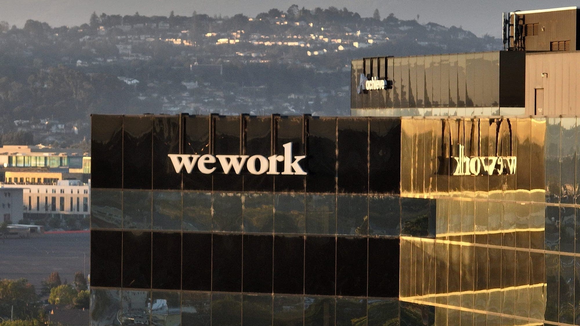 WeWork could declare bankruptcy anytime. How is it still around? - Marketplace