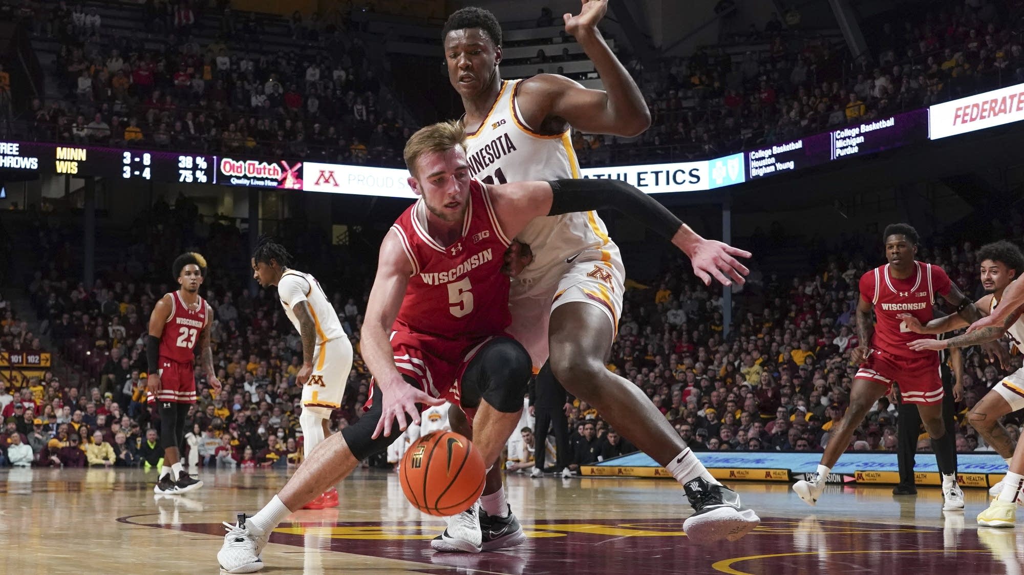 Tyler Wahl helps No. 13 Wisconsin hang on for 61-59 win over rival ...