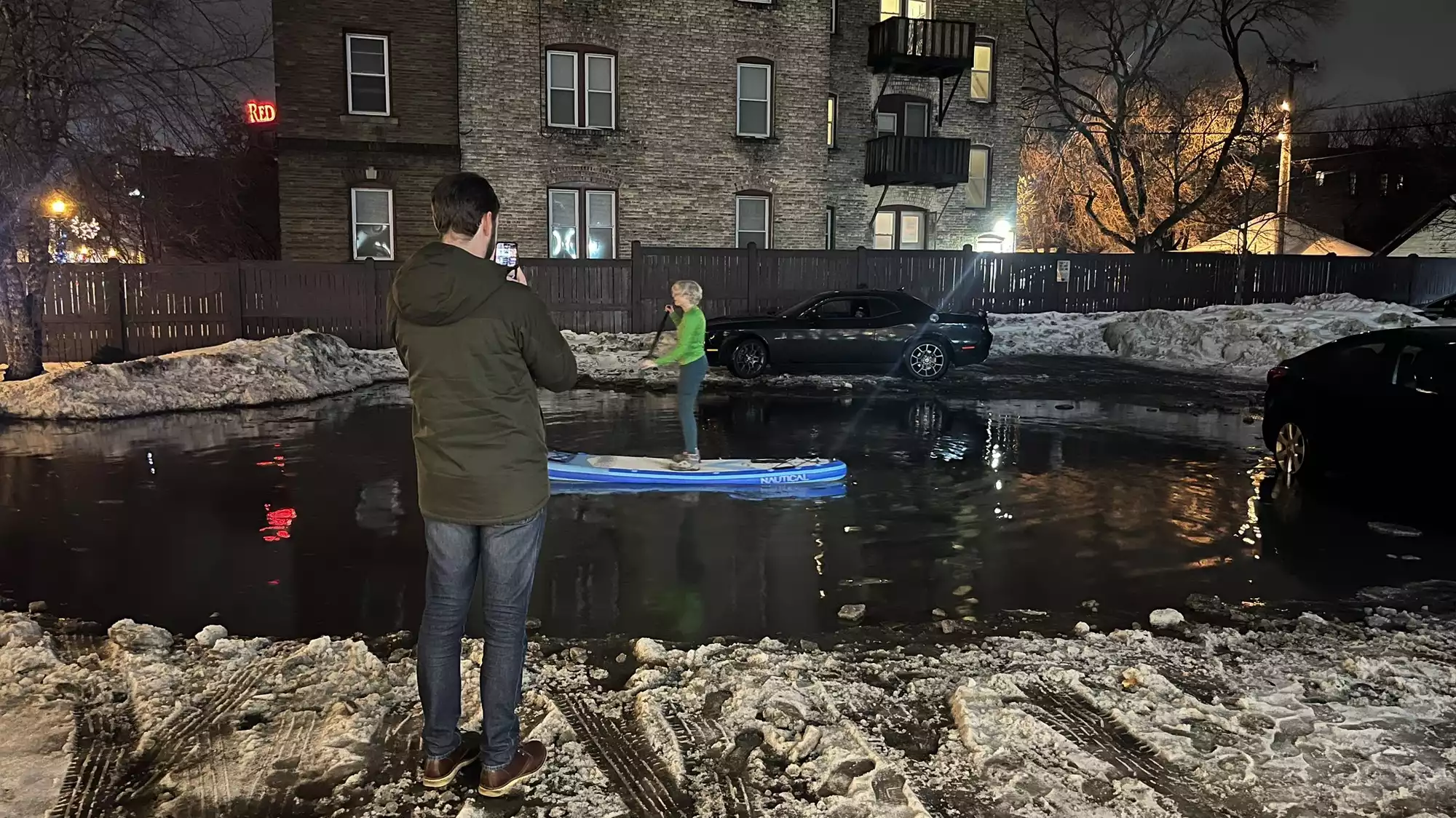 Woman paddleboards ‘Lake Chipotle,’ the famously-flooded Minneapolis ...